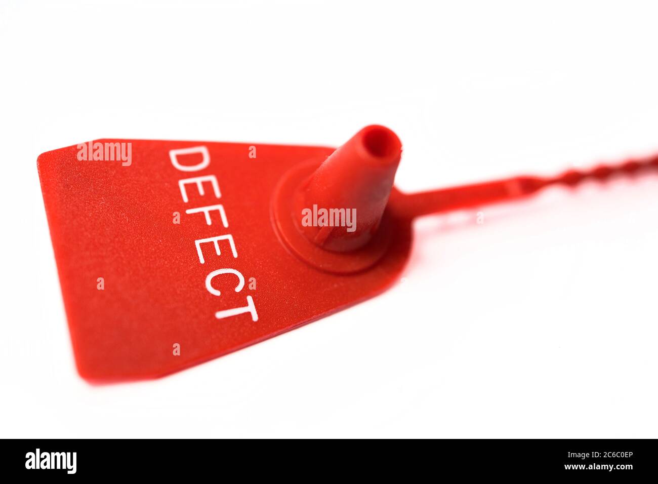 closeup of a red defect marking tag. Warning sign. Attention broken ...