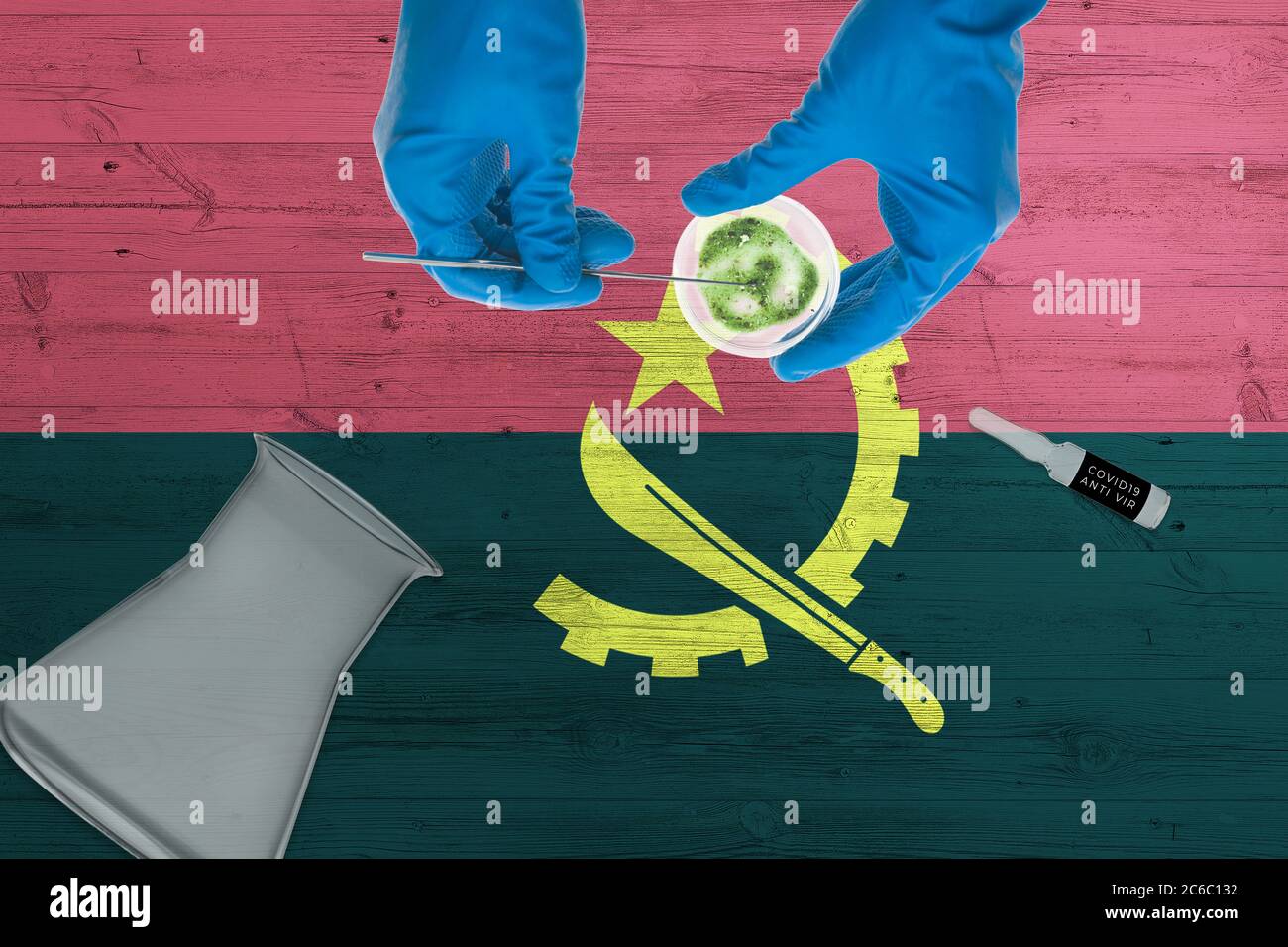 Angola flag on laboratory table. Medical healthcare technologist ...