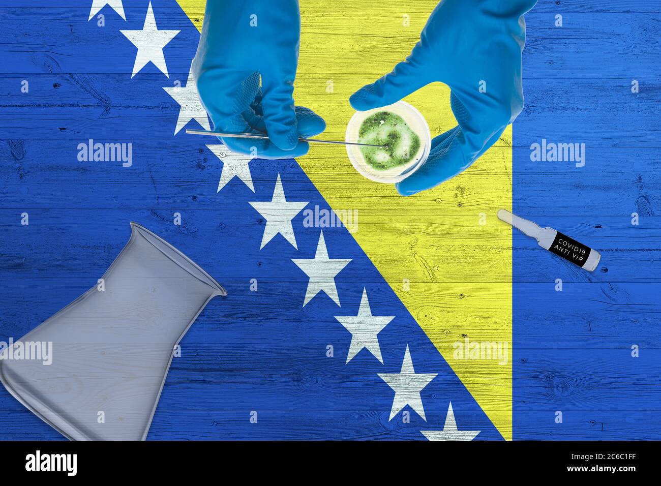 Bosnia Herzegovina flag on laboratory table. Medical healthcare ...