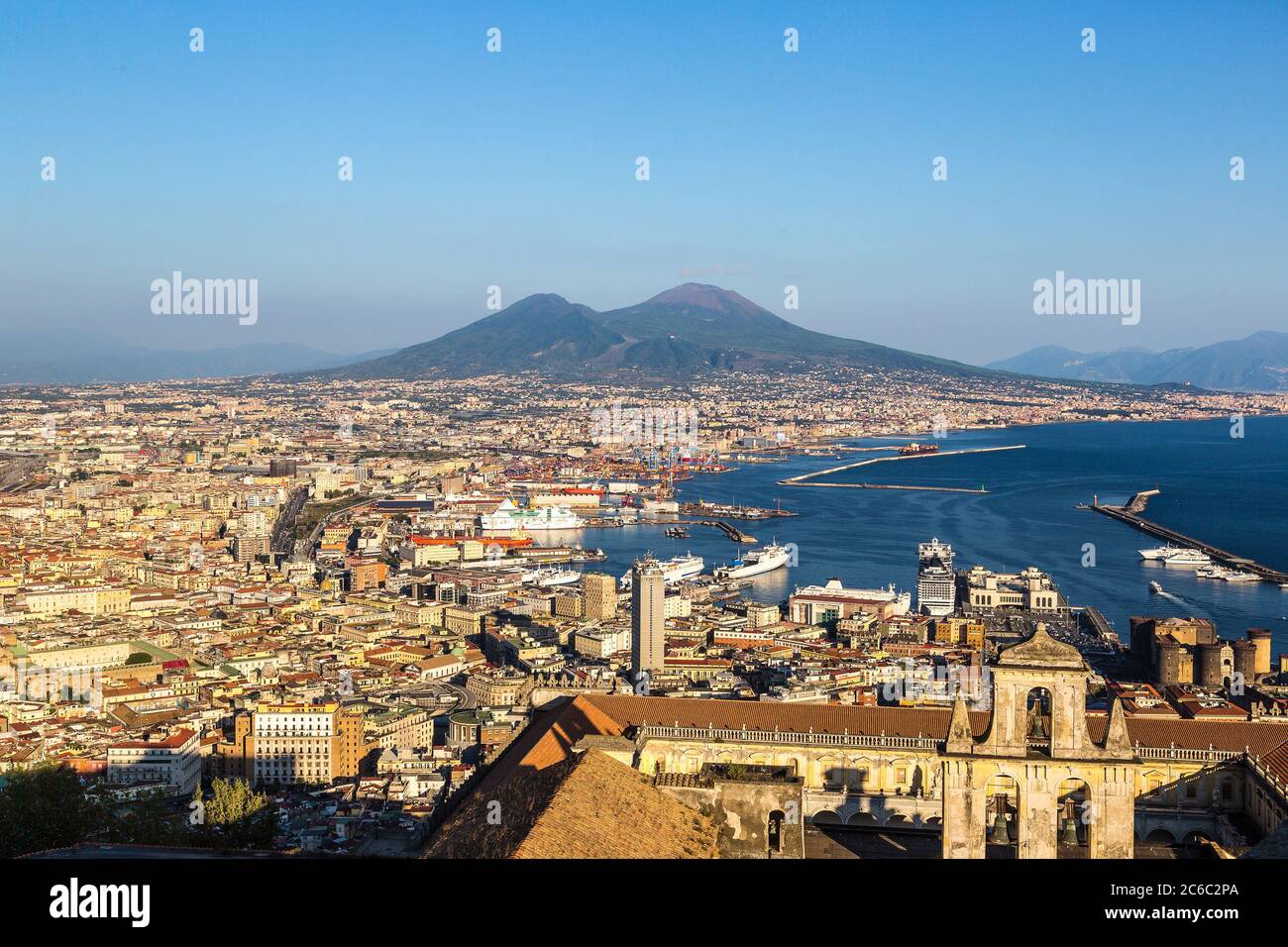 Napoli (Naples) and mount Vesuvius in the background at sunset in a ...