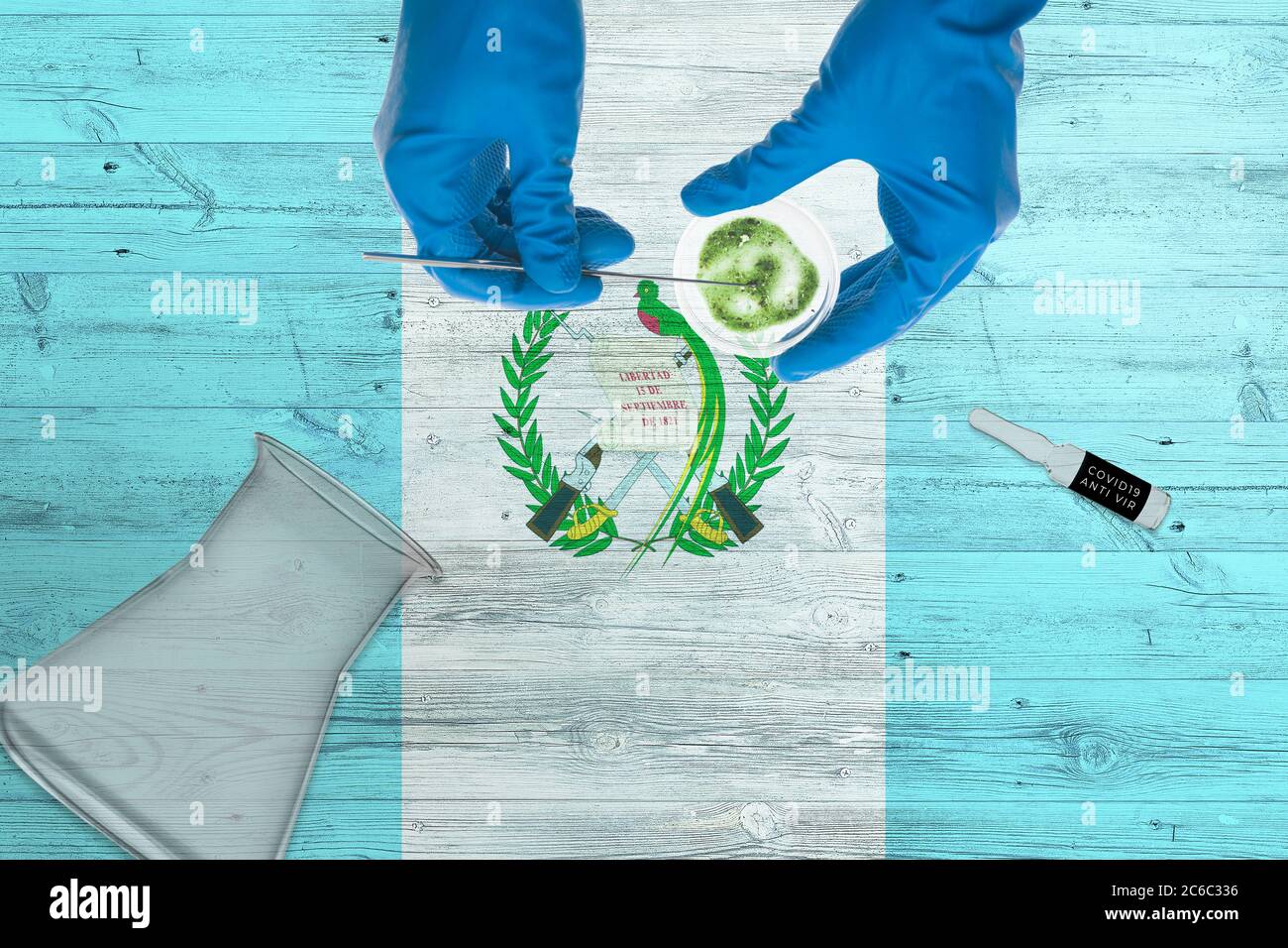 Guatemala flag on laboratory table. Medical healthcare technologist ...