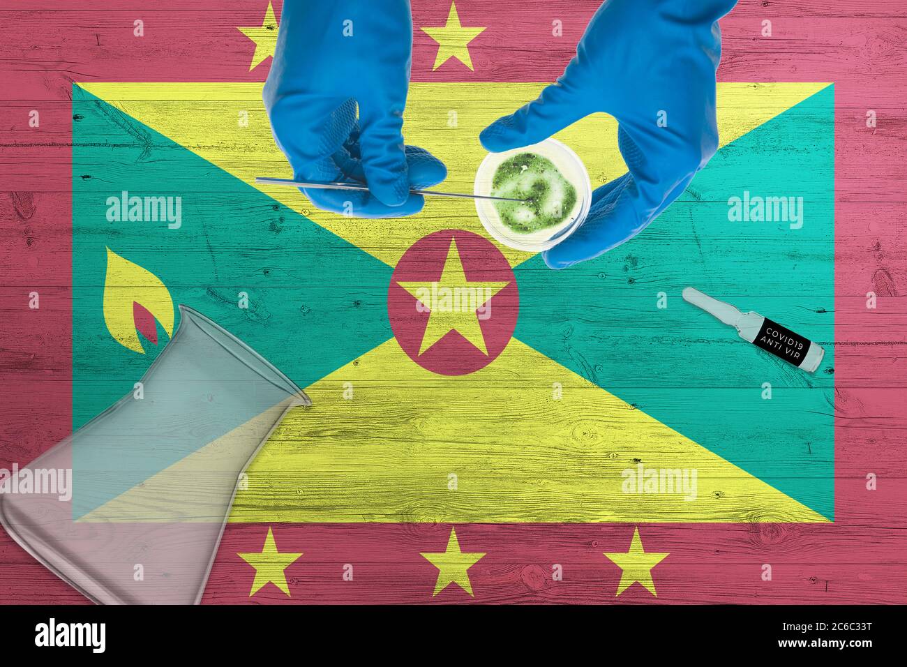 Grenada flag on laboratory table. Medical healthcare technologist ...