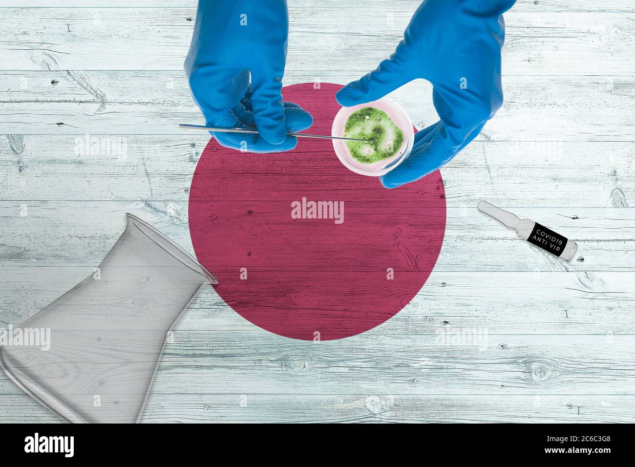 Japan flag on laboratory table. Medical healthcare technologist holding ...