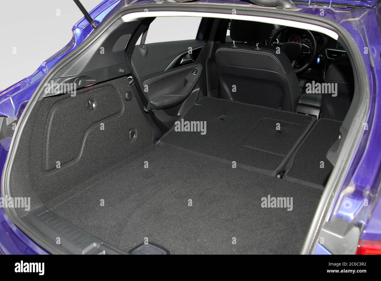 car trunk with rear seats folded Stock Photo - Alamy