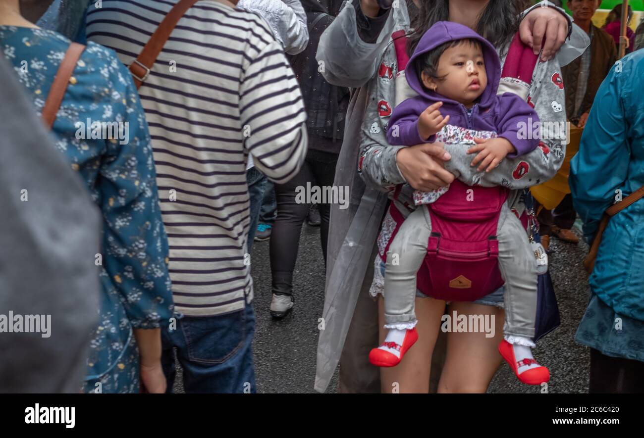 Child being carried hi-res stock photography and images - Alamy