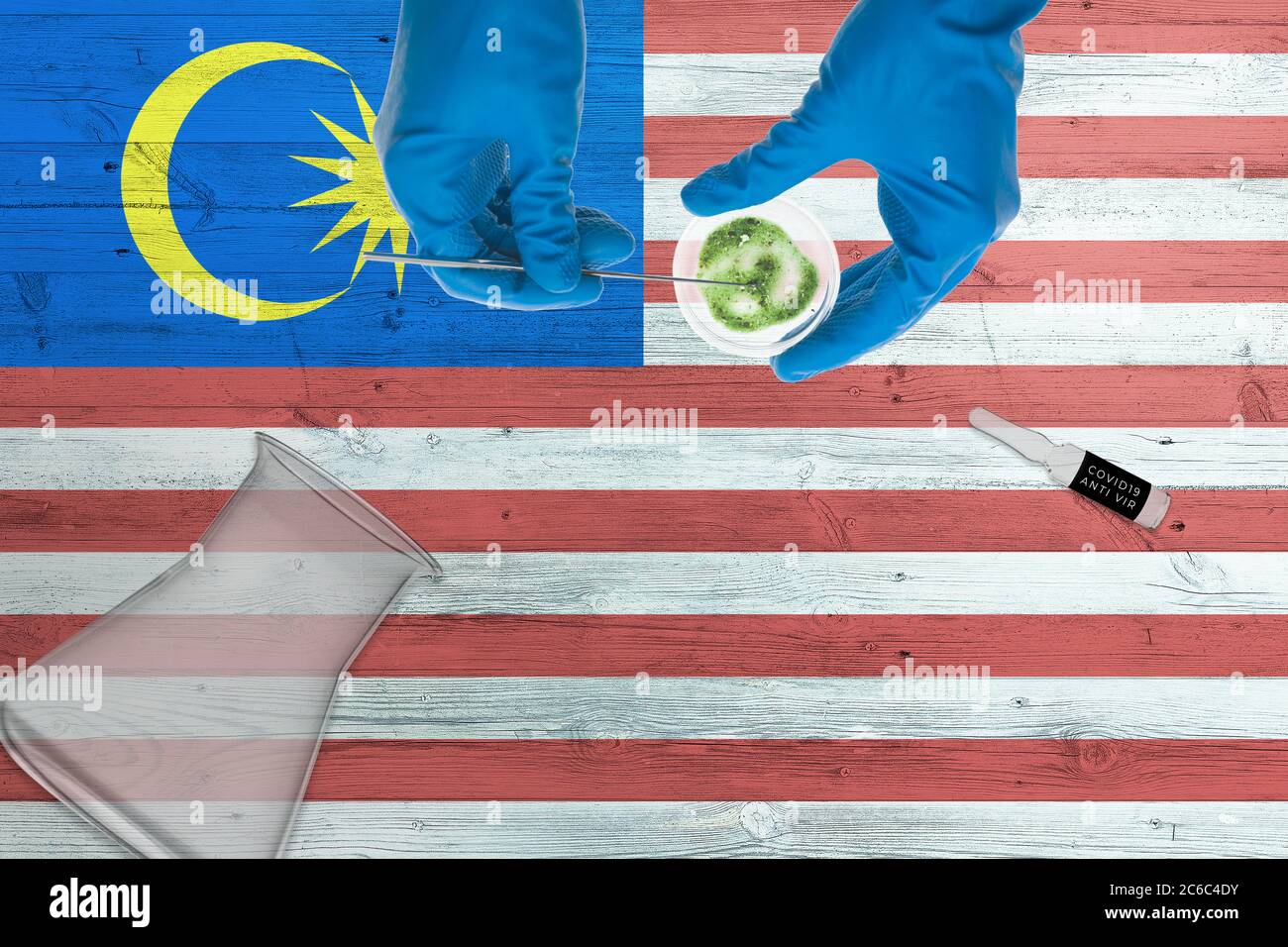 Malaysia flag on laboratory table. Medical healthcare technologist ...