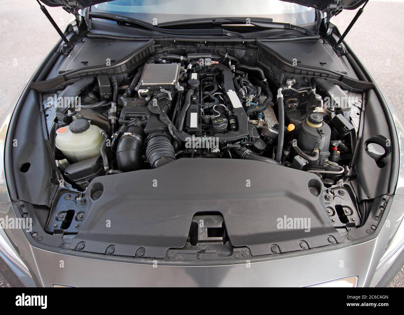 Car engine. Close up of car engine, studio shot. Engine in a passenger ...