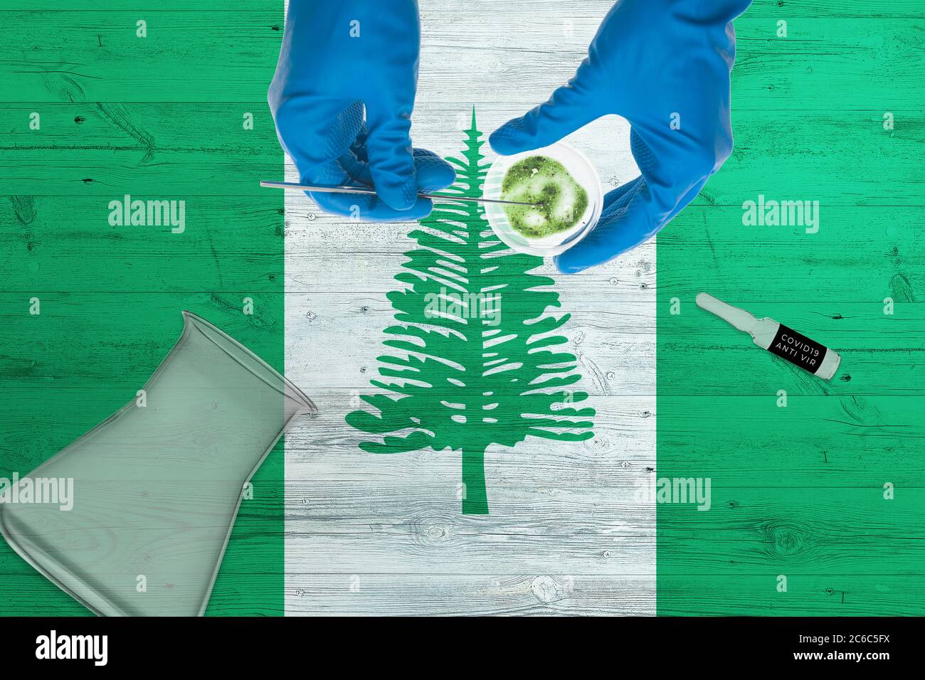 Norfolk Island flag on laboratory table. Medical healthcare ...