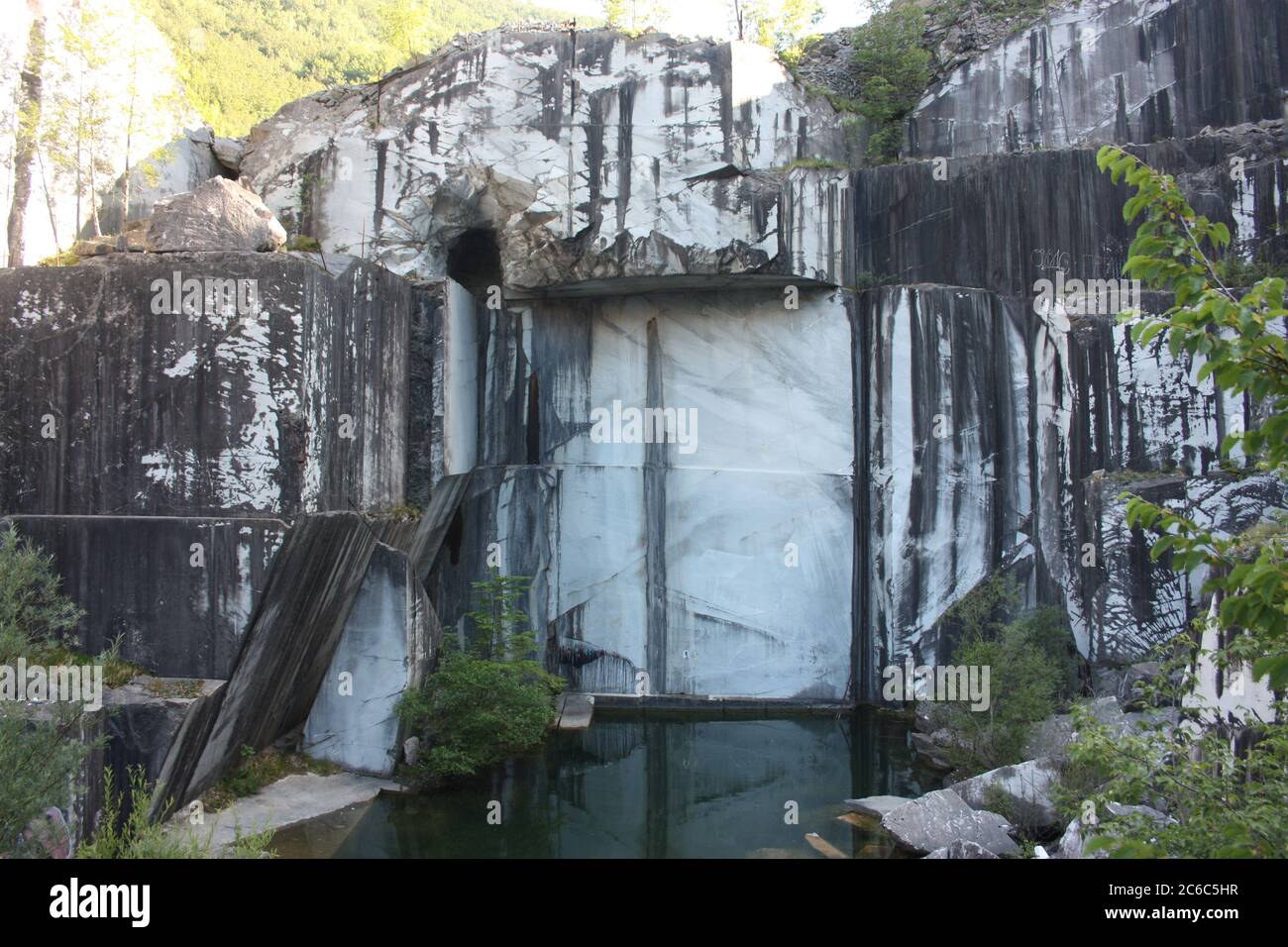 small natural lake inside a marble quarry in mountain in apuan alps ...