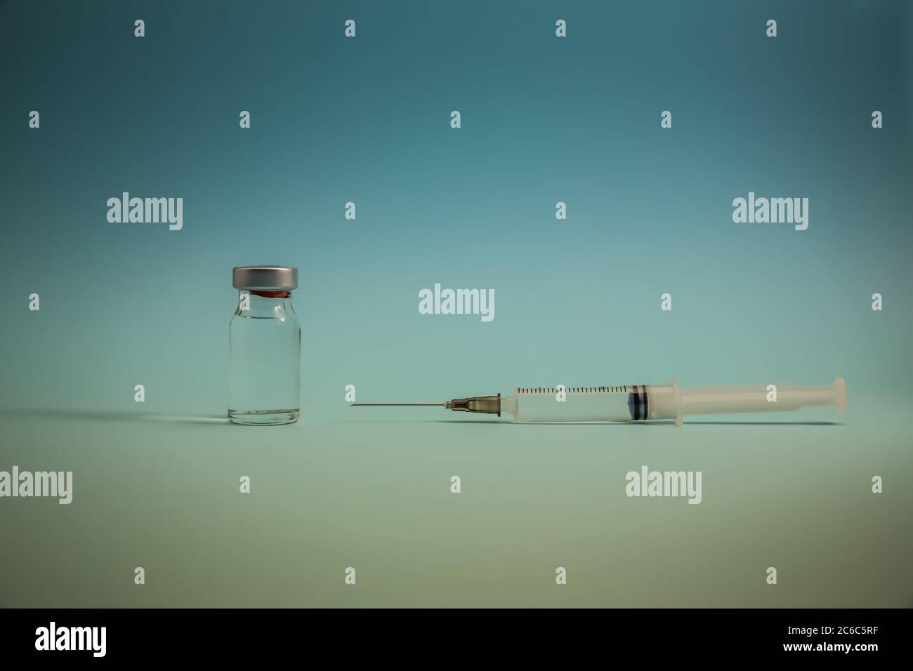 Small vaccine bottle (phial) and a medical syringe injection isolated ...