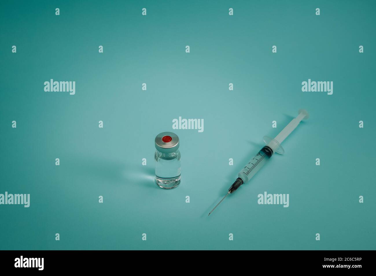 Small vaccine bottle (phial) and a medical syringe injection isolated ...