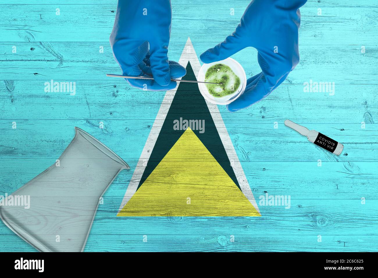 Saint Lucia flag on laboratory table. Medical healthcare technologist ...