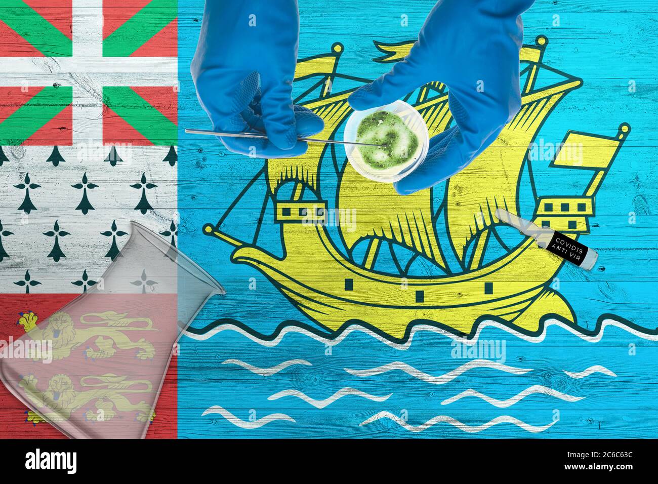 Saint Pierre And Miquelon flag on laboratory table. Medical healthcare ...