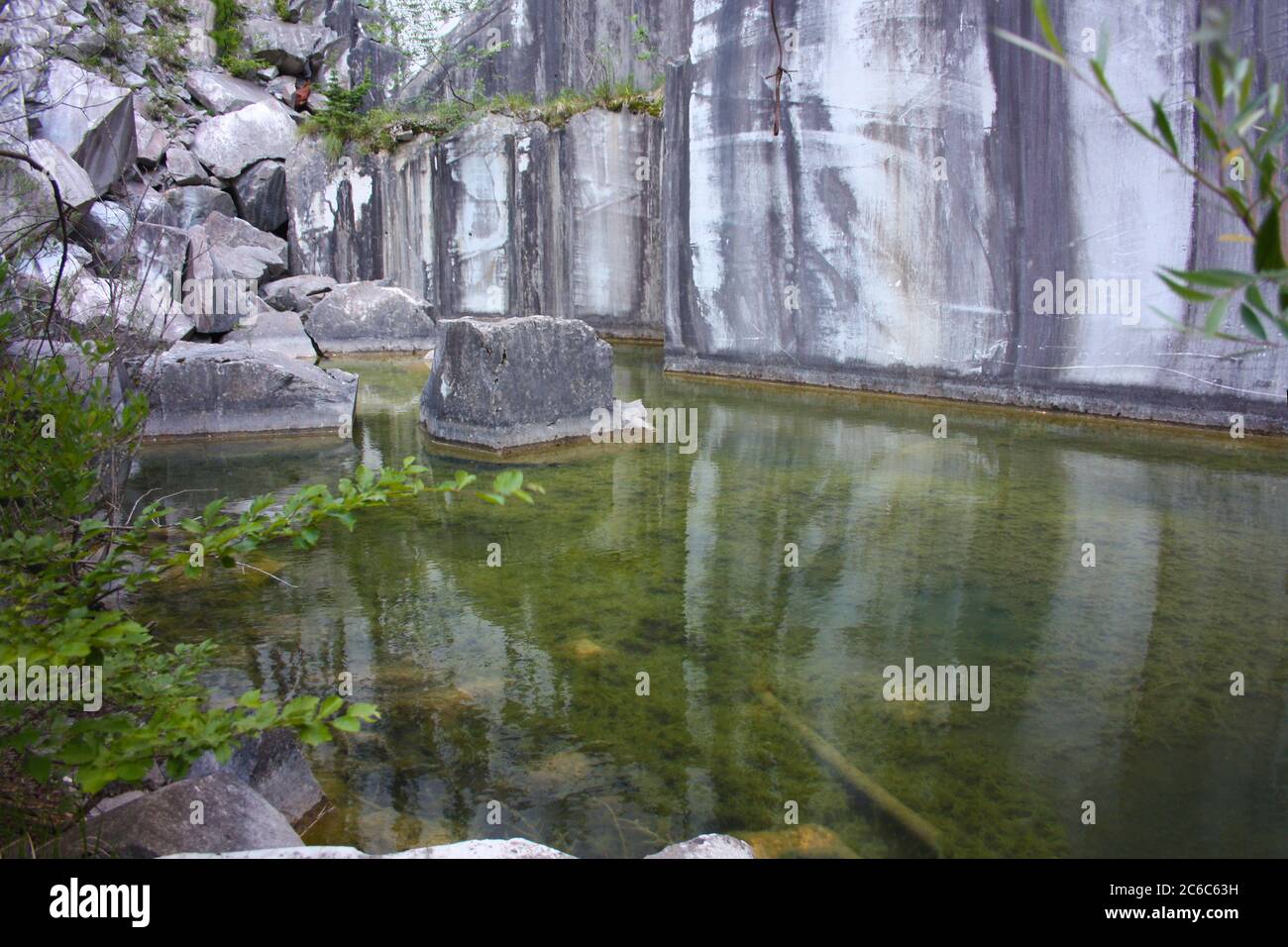 small natural lake inside a marble quarry in mountain in apuan alps ...