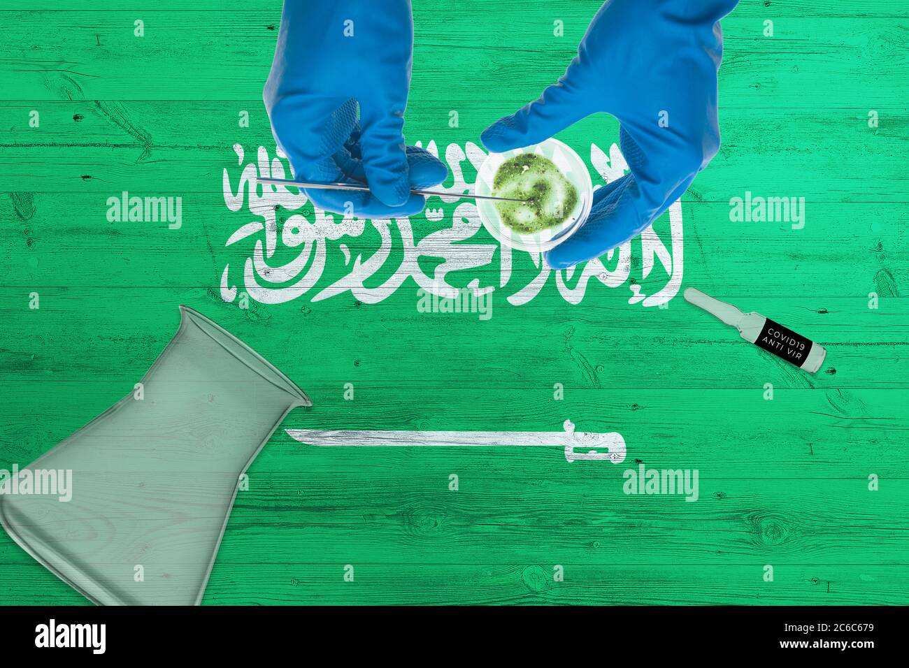 Saudi Arabia flag on laboratory table. Medical healthcare technologist ...