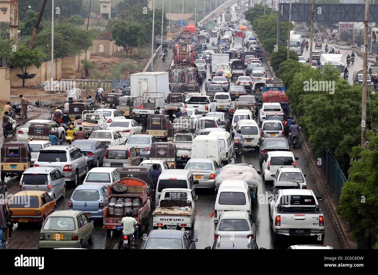 A large numbers of vehicles stuck in traffic jam during heavy downpour ...