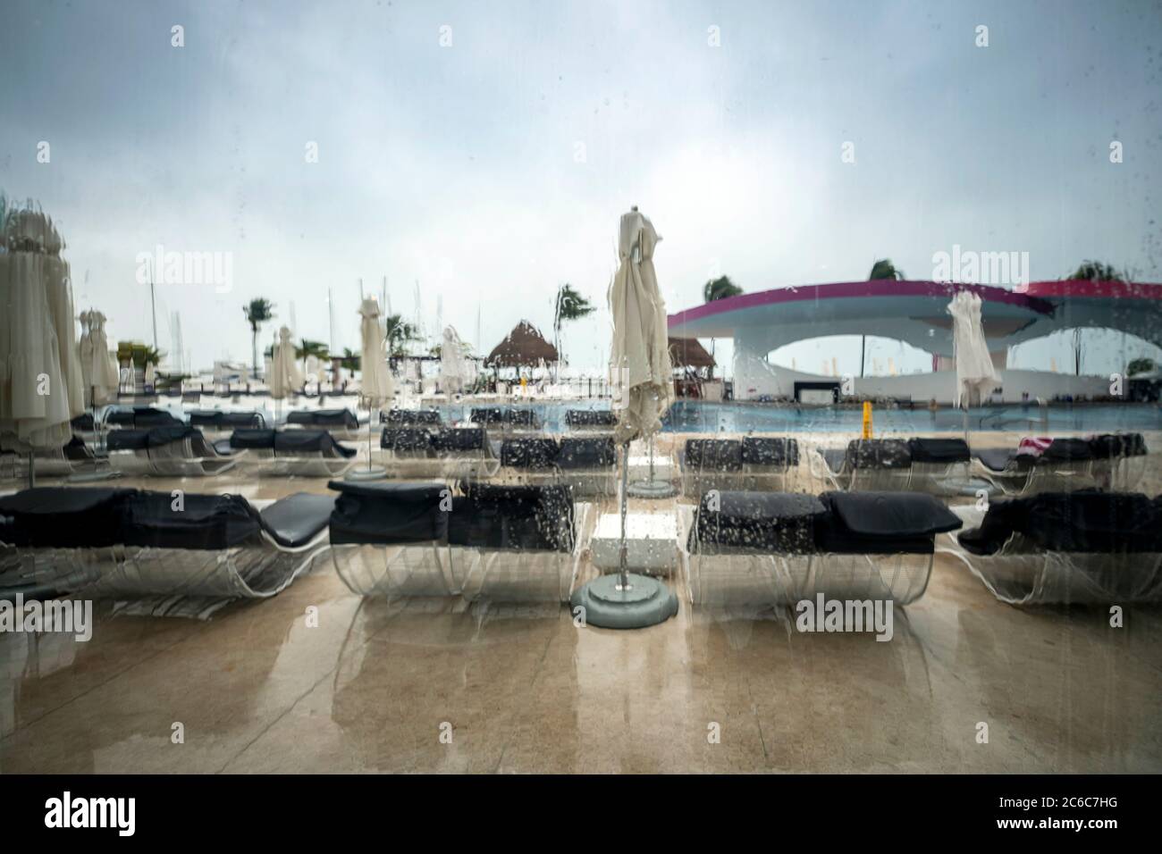 View through the window. Rainy day at tropical resort Stock Photo - Alamy