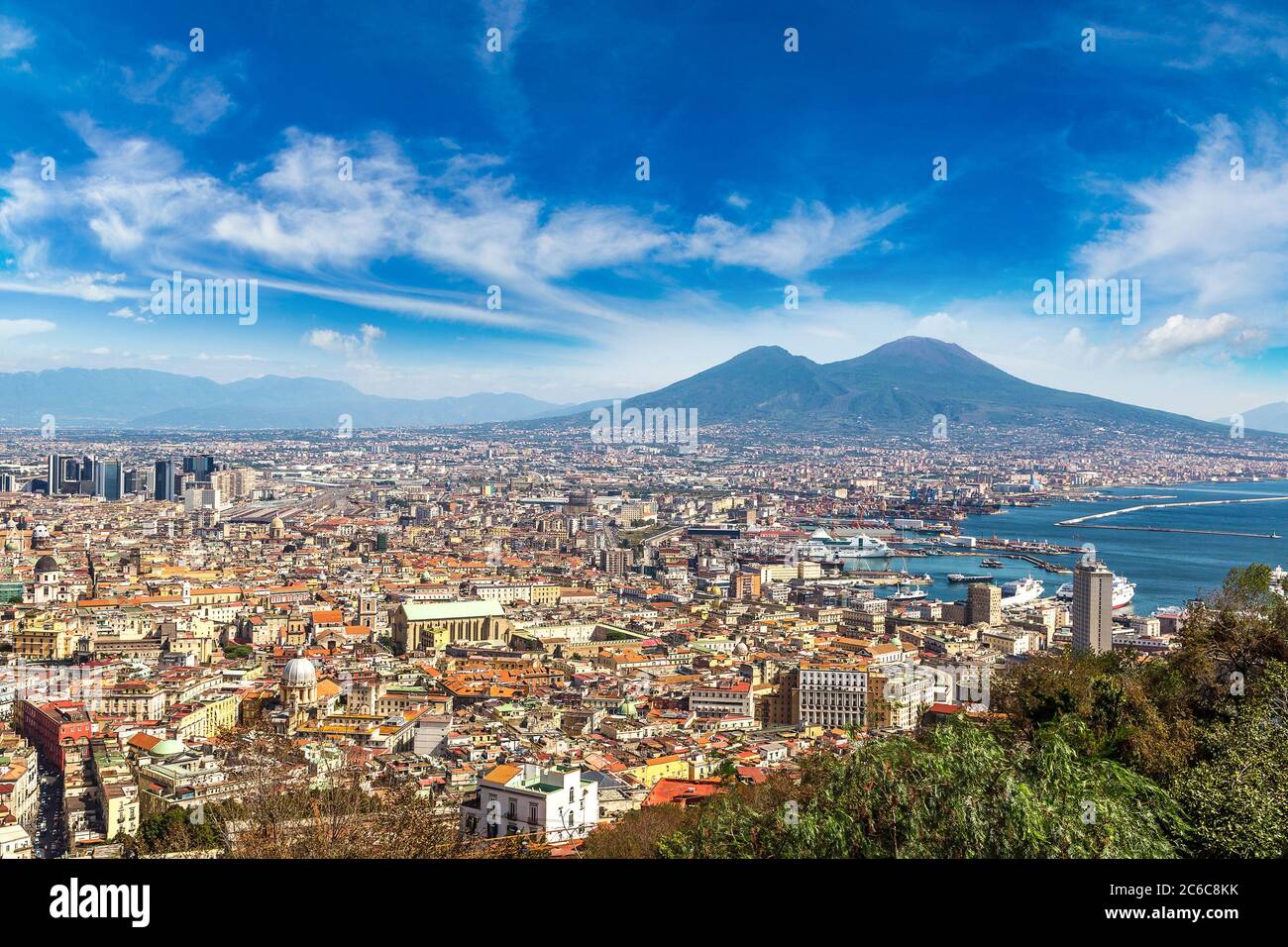 Napoli (Naples) and mount Vesuvius in the background at sunset in a ...