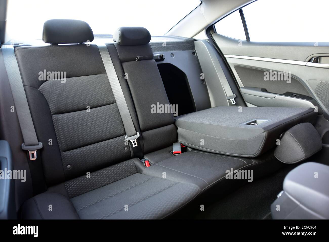 Folded rear seat of the car. Down rear seats of a modern passenger car ...