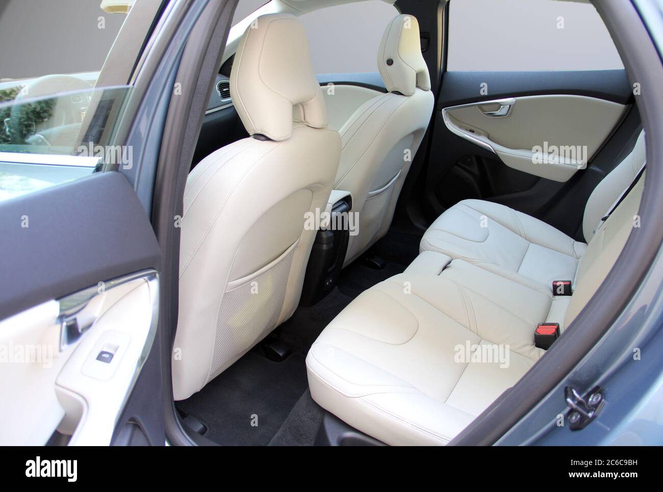 the white rear seat of a luxury passenger car Stock Photo - Alamy