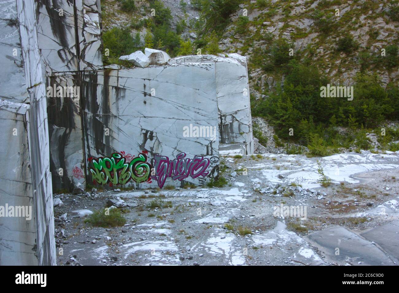 colorful graffiti in an abandoned marble quarry in the mountains in ...