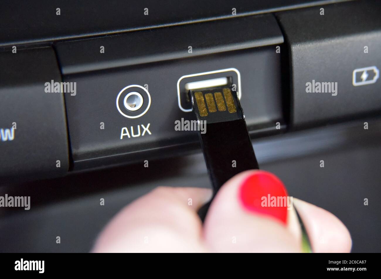 Plugging USB storage into the USB port on the car dashboard Stock Photo ...