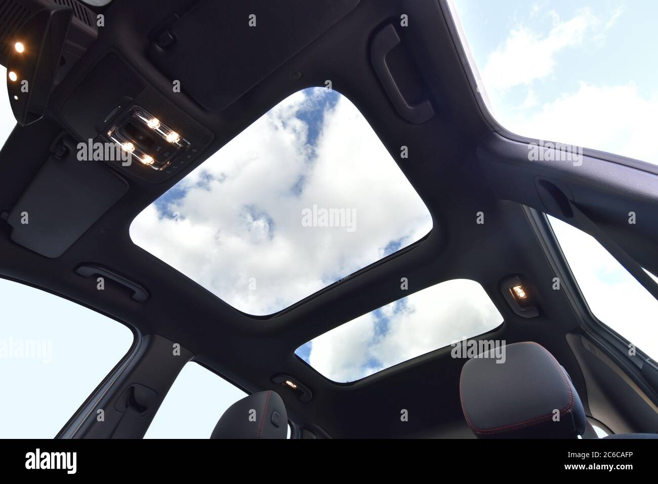 Panoramic double sunroof in a passenger car Stock Photo - Alamy