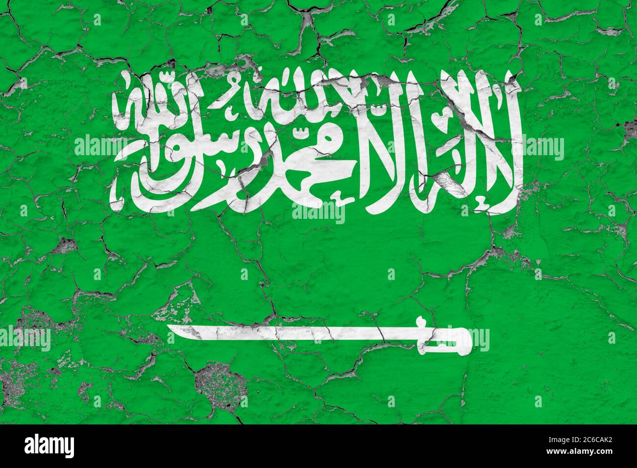 Saudi Arabia flag close up grungy, damaged and weathered on wall ...