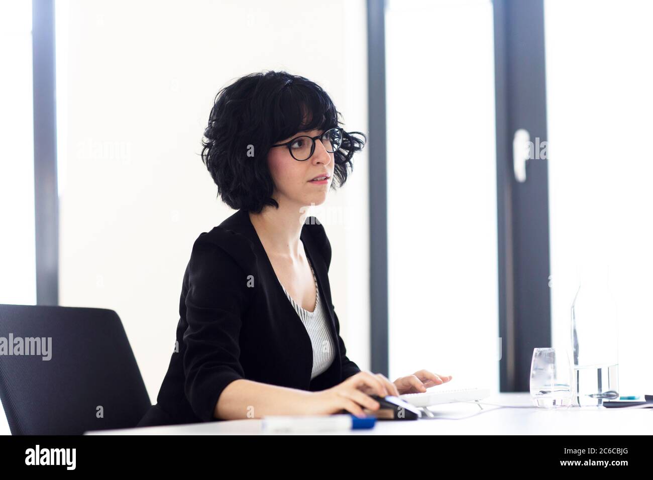 Business woman sitting in the office with the chief hi-res stock ...