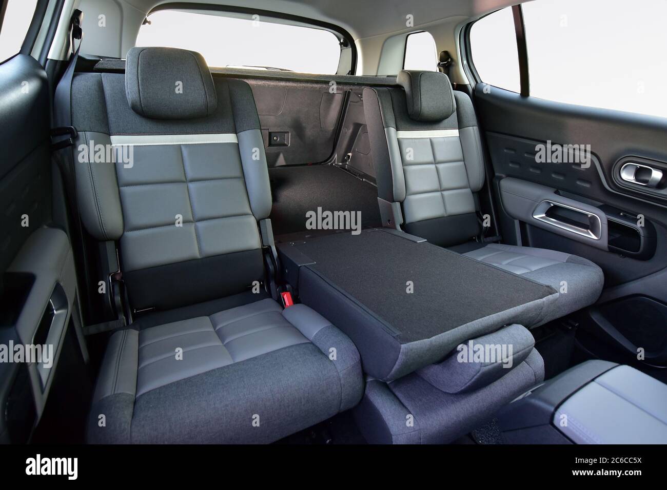 rear seatback folded in passenger car Stock Photo - Alamy