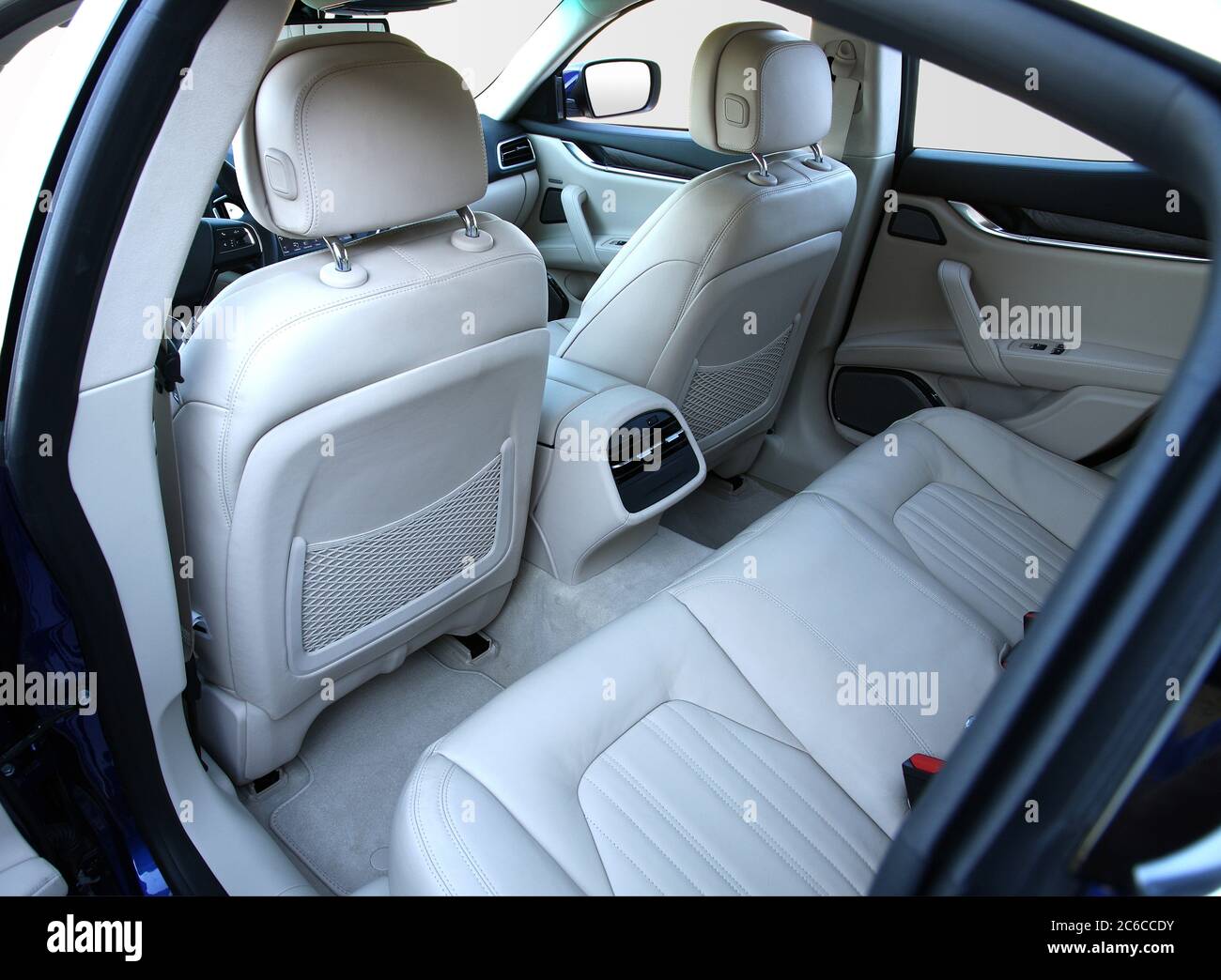 the white rear seat of a luxury passenger car Stock Photo - Alamy