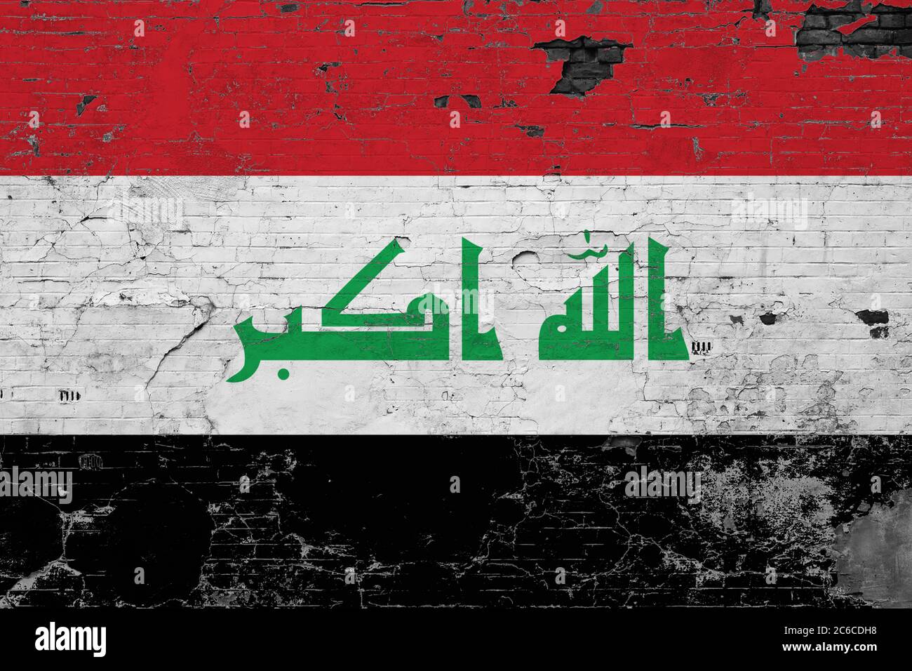 Iraq flag on grunge scratched concrete surface. National vintage ...