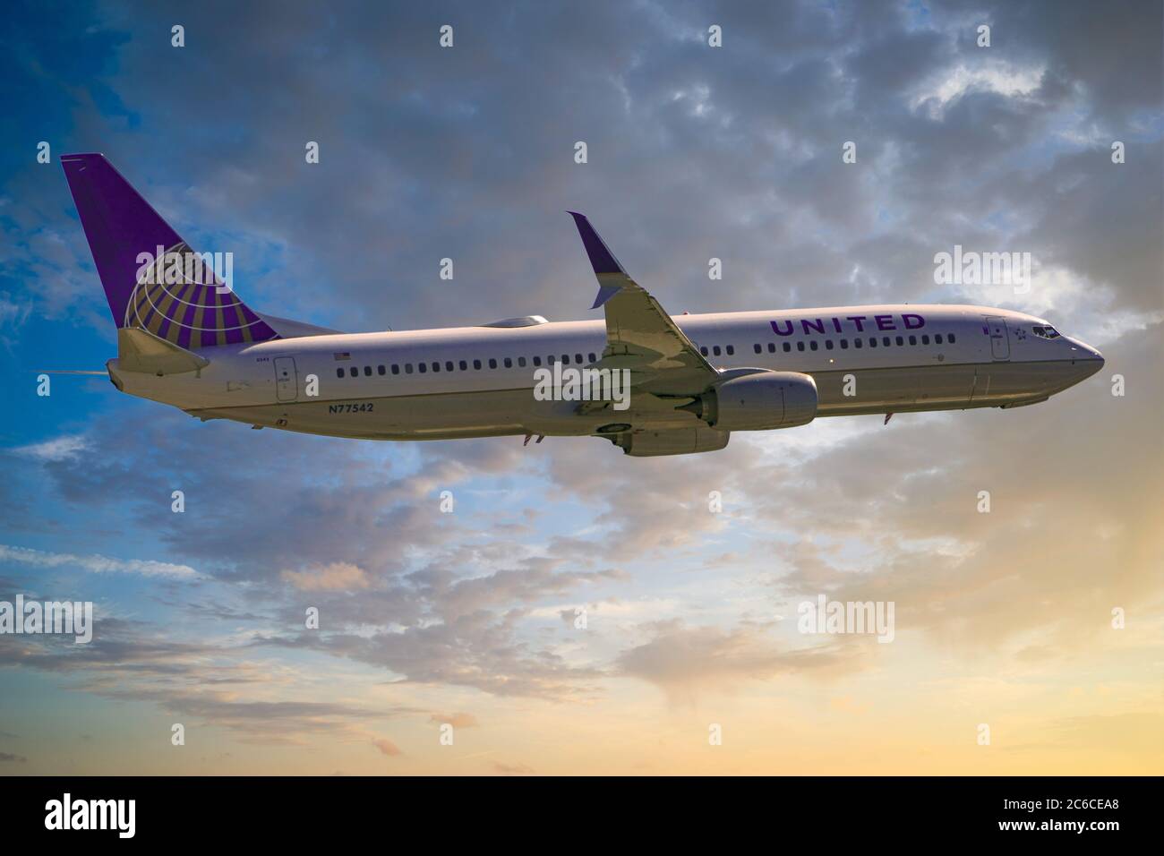 United Airlines Boeing 737 en-route over America at sunset Stock Photo ...