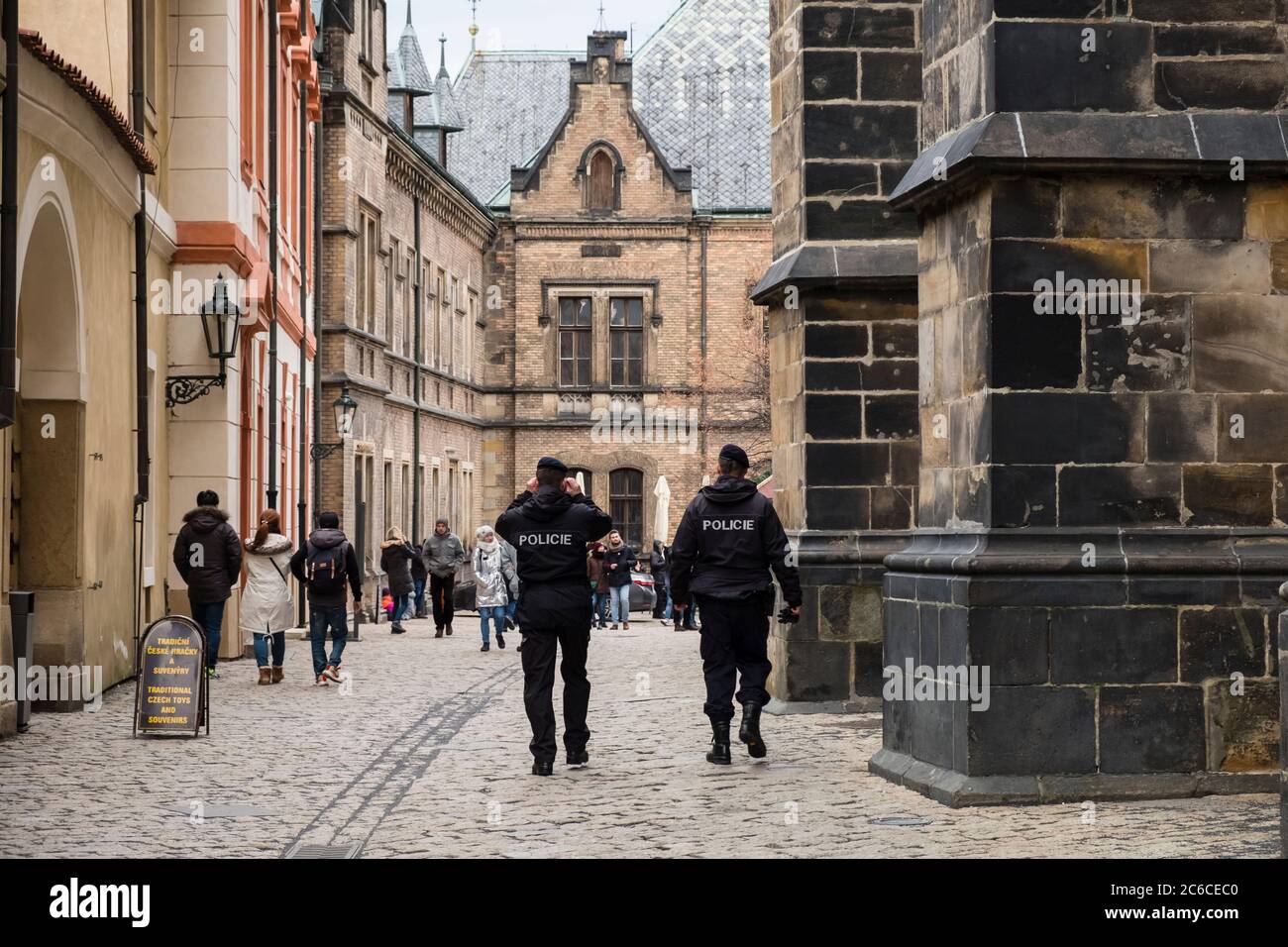 Two Czech police officers patrol within the grounds of Prague Castle ...