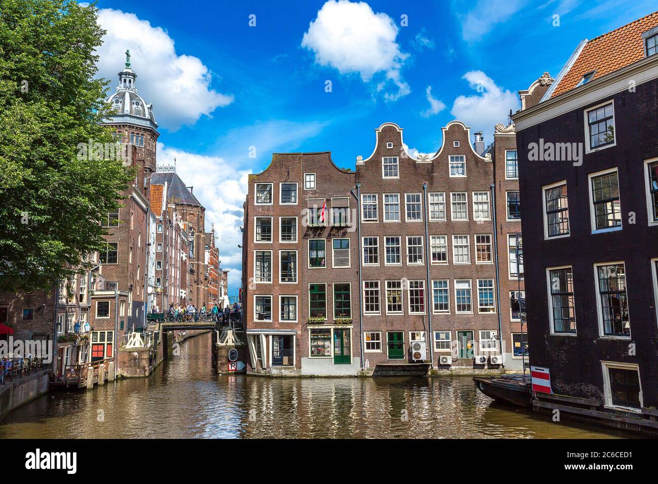 Canal and St. Nicolas Church in Amsterdam. Amsterdam is the capital and most populous city of ...