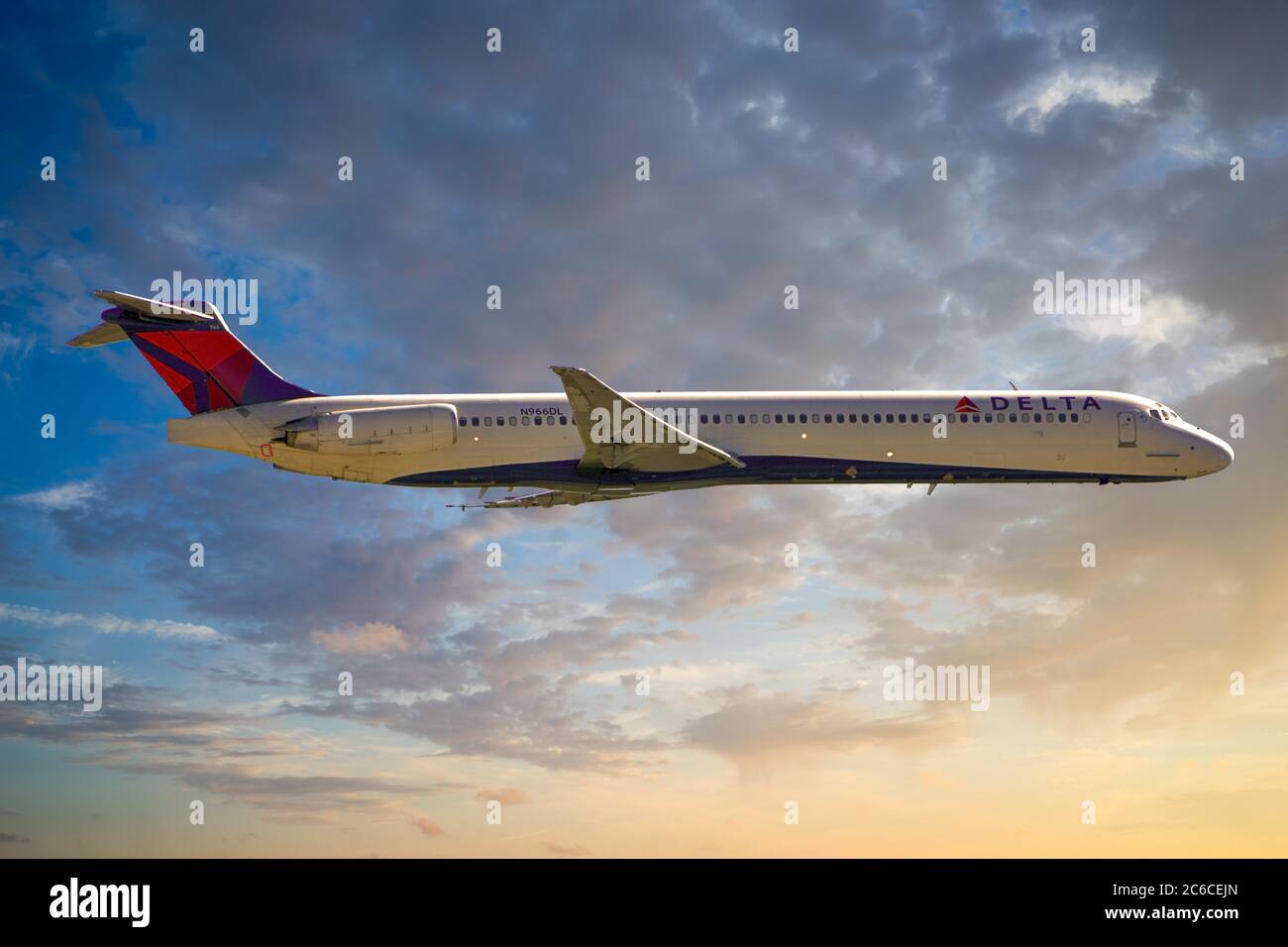 Delta Airlines MD-88 en-route at sunset over America on a scheduled ...
