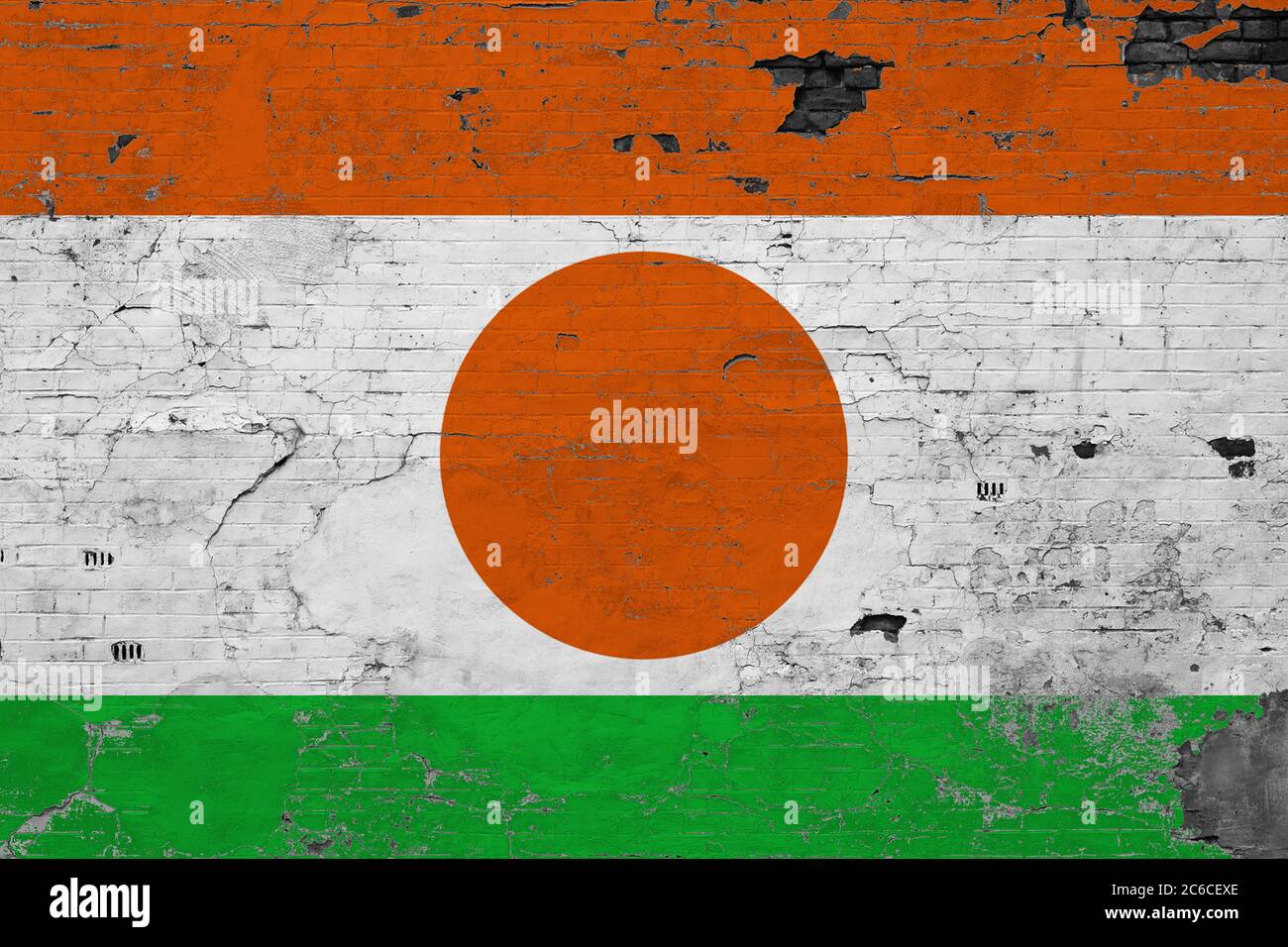 Niger flag on grunge scratched concrete surface. National vintage ...