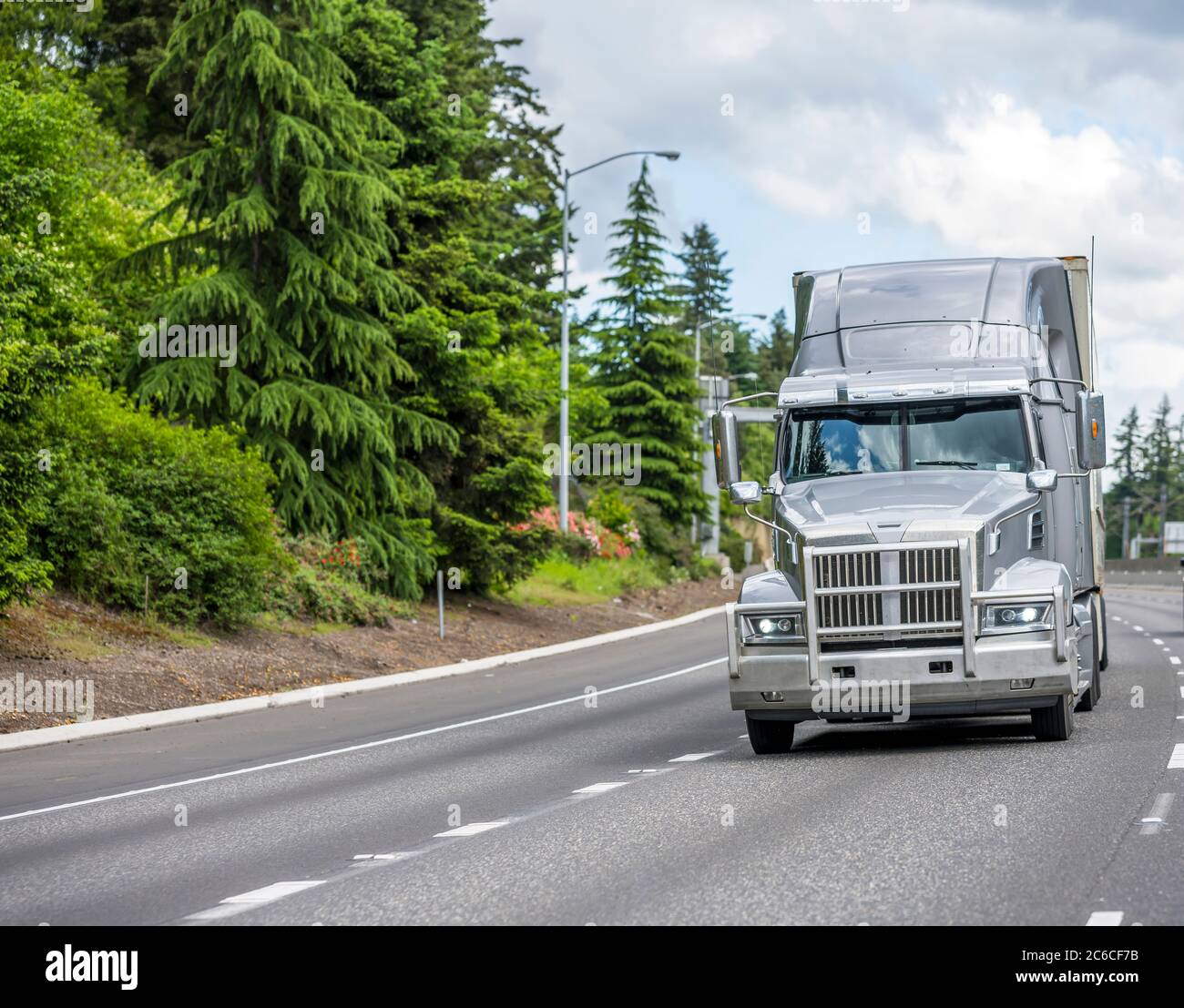 Gray bonnet big rig long hauler industrial semi truck transporting ...