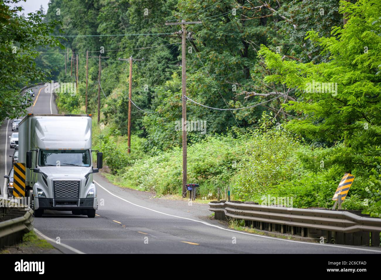 White bonnet big rig long hauler industrial semi truck transporting ...