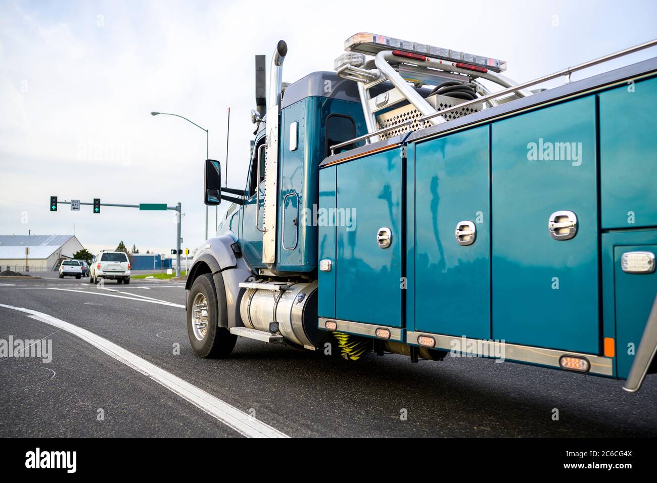 Powerful heavy-duty big rig mobile tow semi truck with emergency lights ...