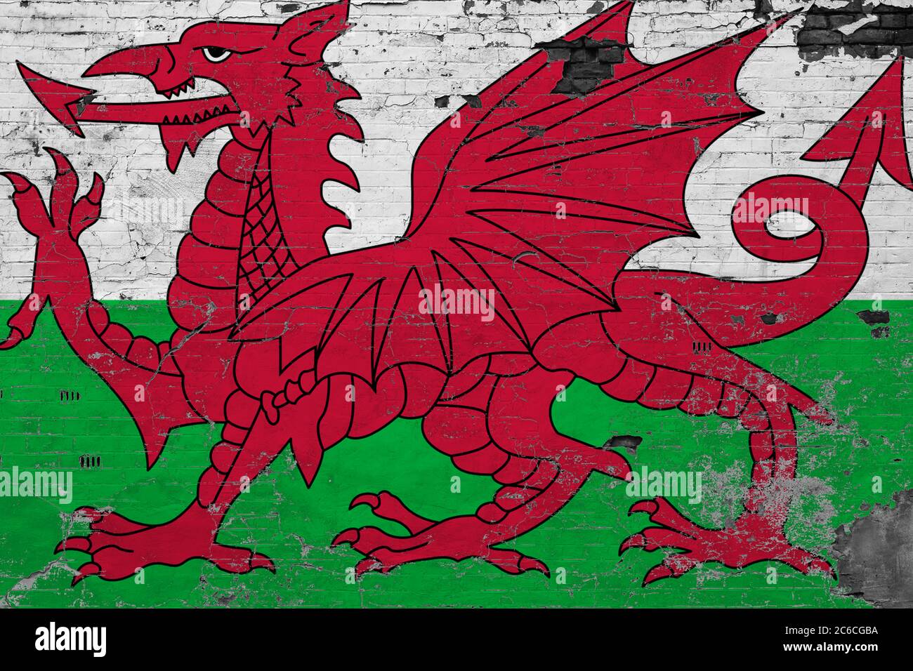 Wales flag on grunge scratched concrete surface. National vintage ...