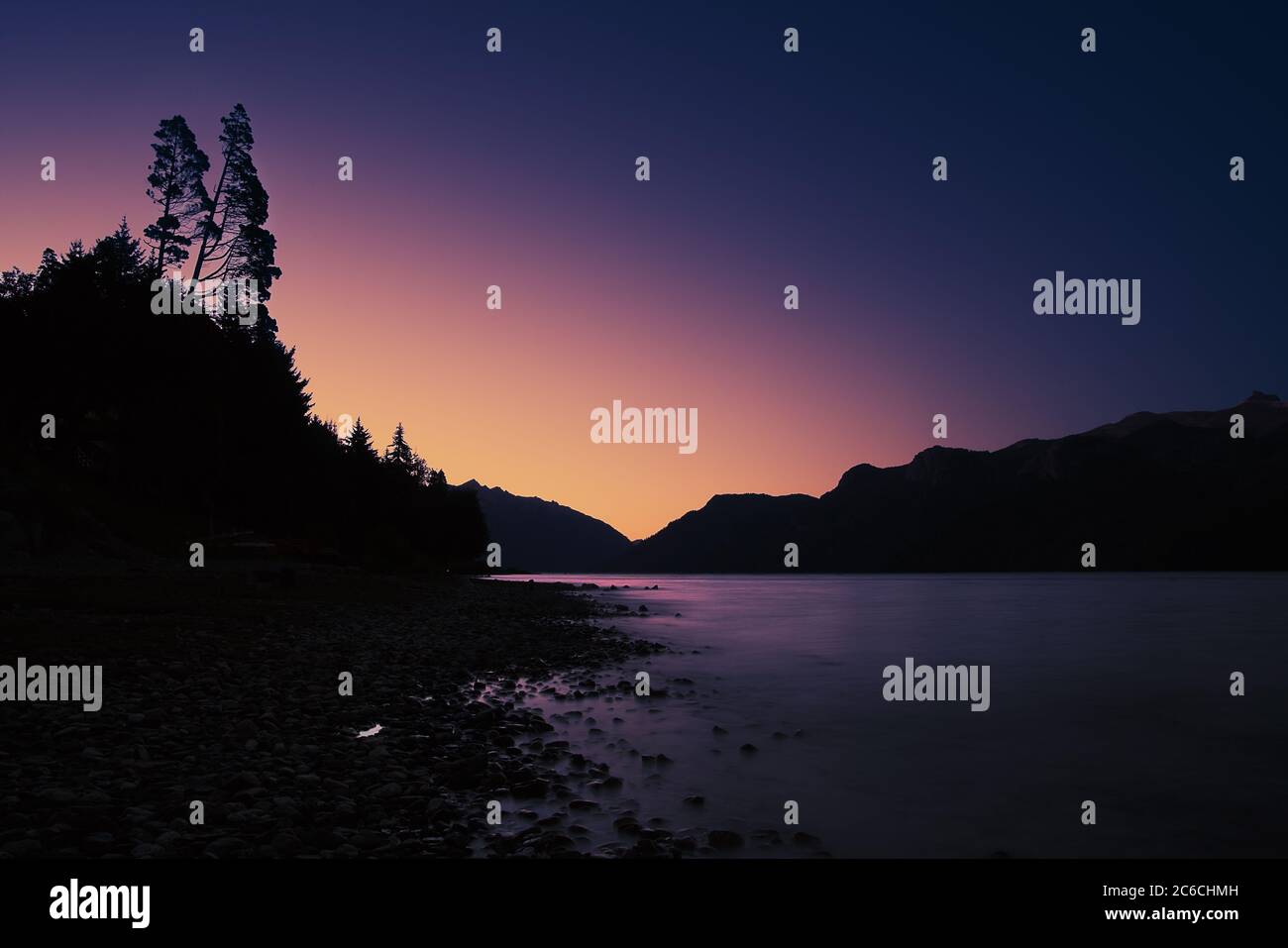 Patagonian violet landscape on the rocky lake in a summer day Stock ...