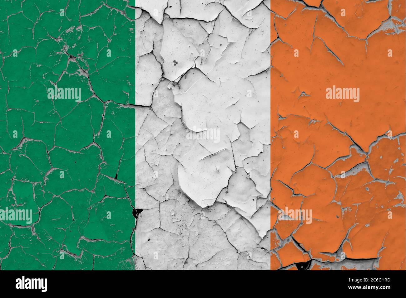 Ireland flag close up grungy, damaged and scratched on wall peeling off ...