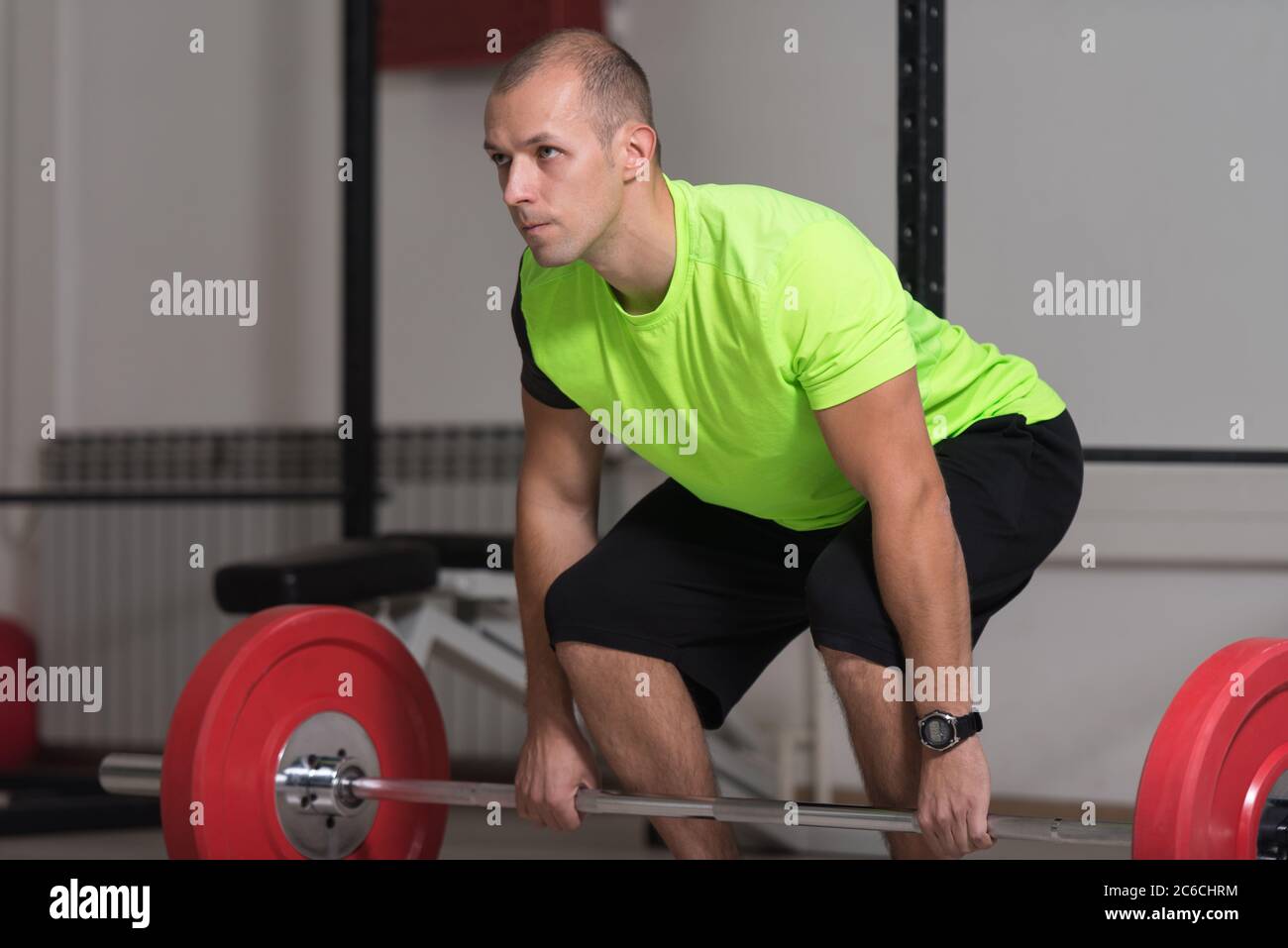 Couch Doing Heavy Weight Exercise For Back With Barbell In Gym Stock ...