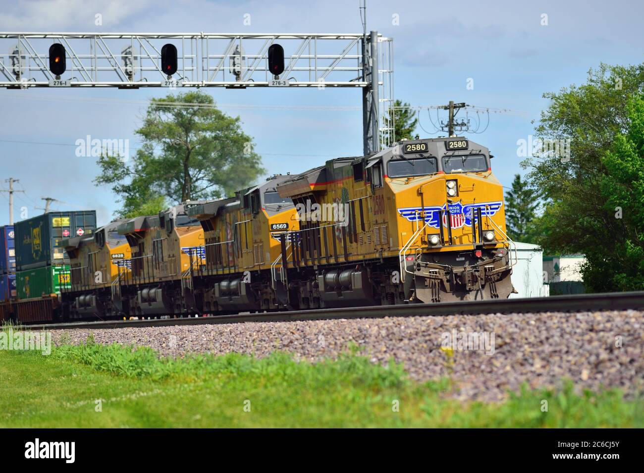 Winfield, Illinois, USA. Four locomotives lead a westbound Union Pacific intermodal freight ...