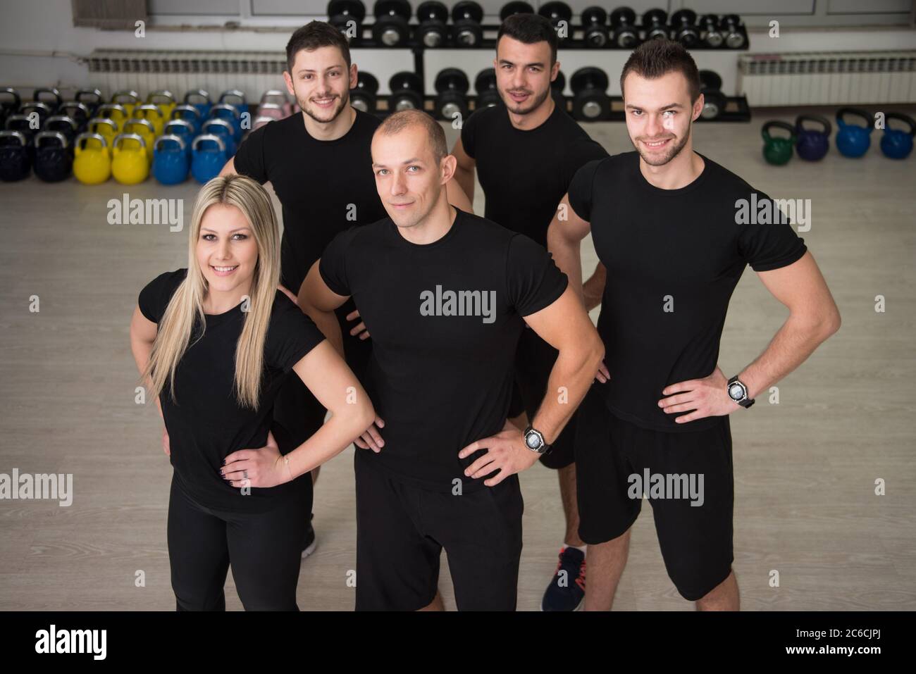 Smiling Group of Friends in Sportswear Laughing While Standing Together ...