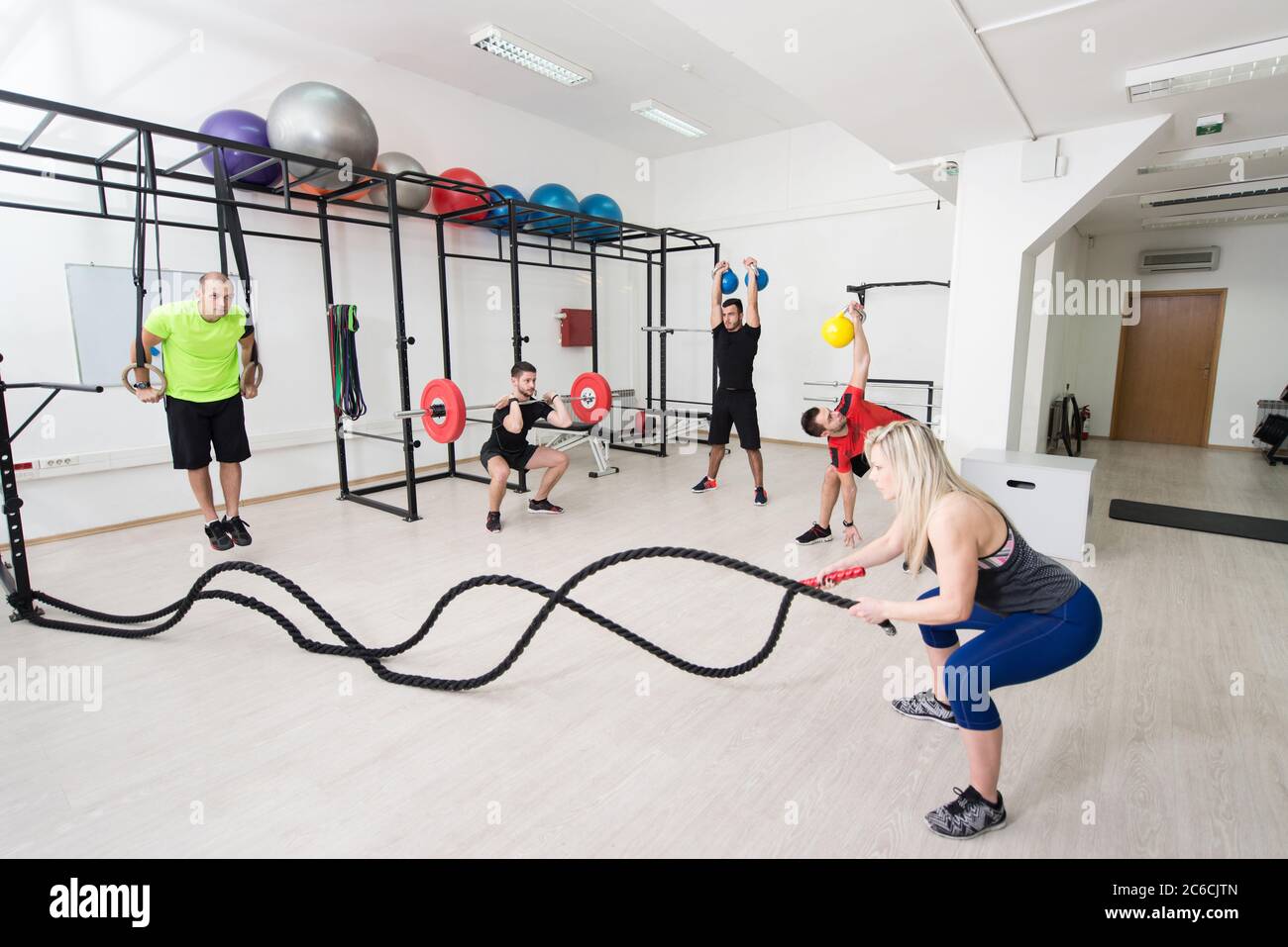 Gym Group Weight Lifting Workout Men and Girls Exercise Stock Photo - Alamy