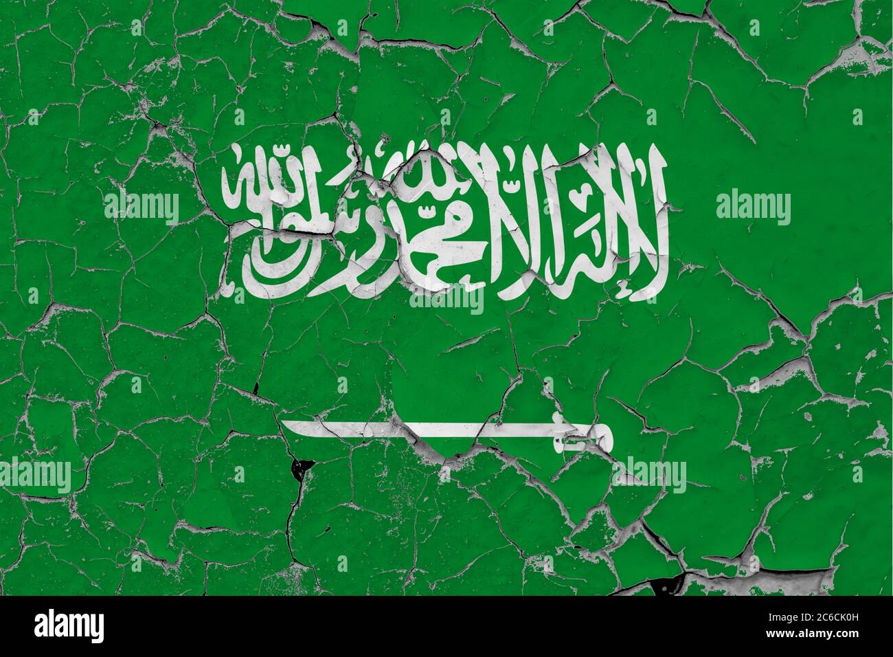 Saudi Arabia flag close up grungy, damaged and scratched on wall ...