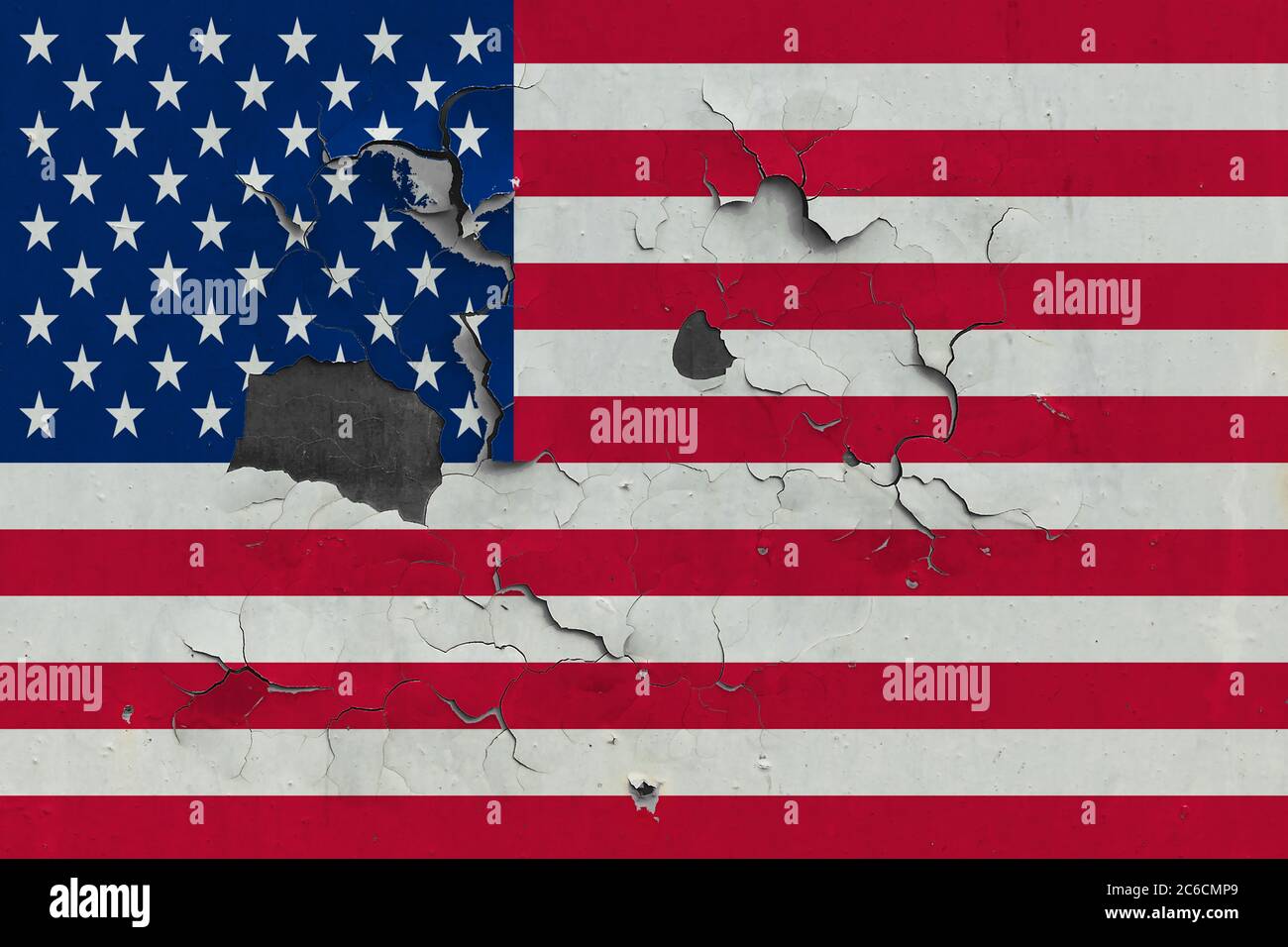 United States flag close up old, damaged and dirty on wall peeling off ...