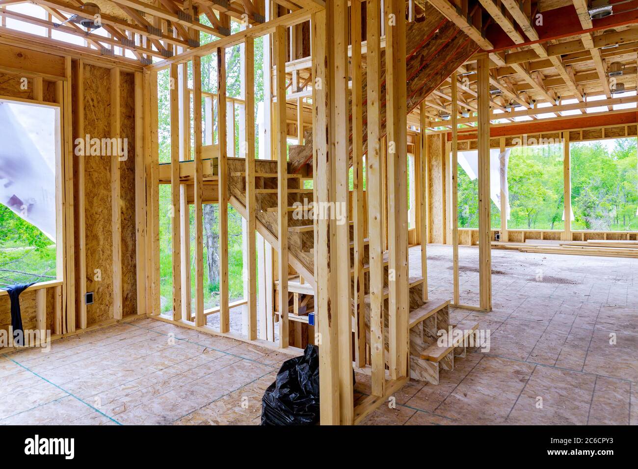 Framing of under construction wooden house building frame structure on ...